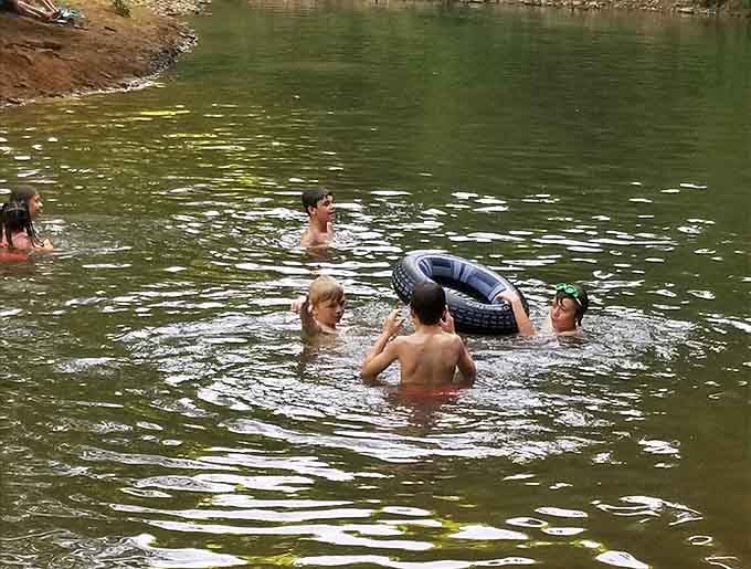 Kids, inner tubes, and a creek that doesn't care about your screen time. Pure gold.