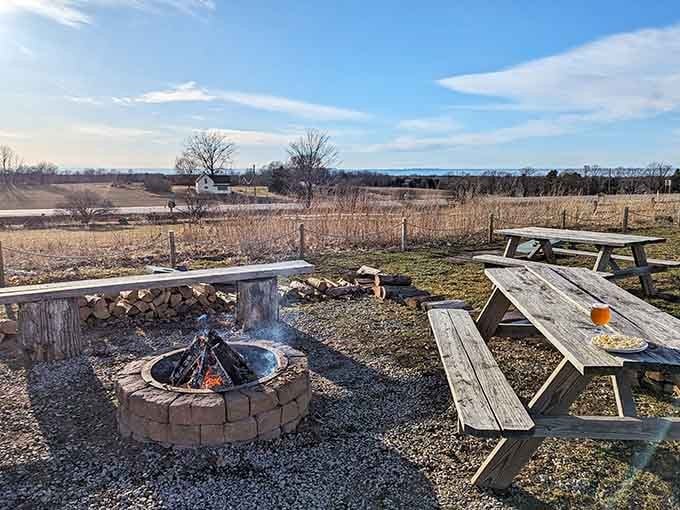 A crackling fire pit, picnic tables, open fields, and Lake Michigan on the horizon. This is the good life, friends.