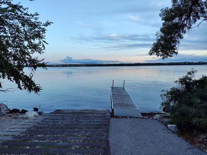 A boat ramp at dusk, with the whole lake stretched out ahead. The fish aren't going to catch themselves.