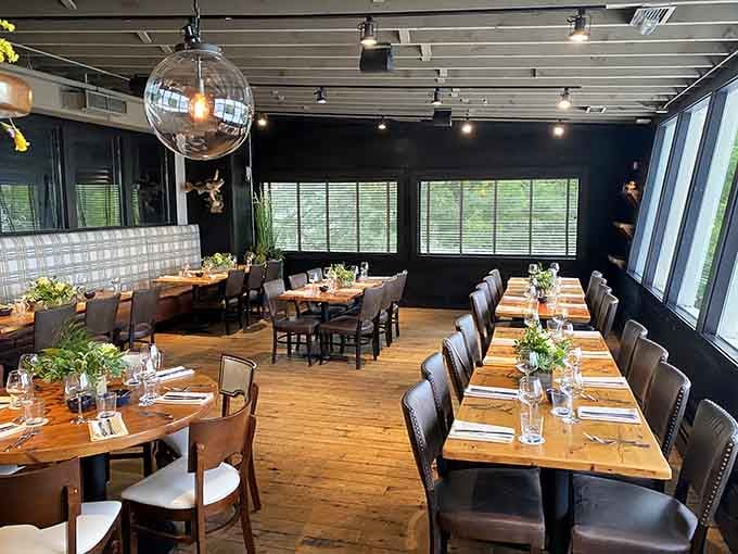 The modern dining room with disco ball charm offers intimate seating and natural light for every occasion.