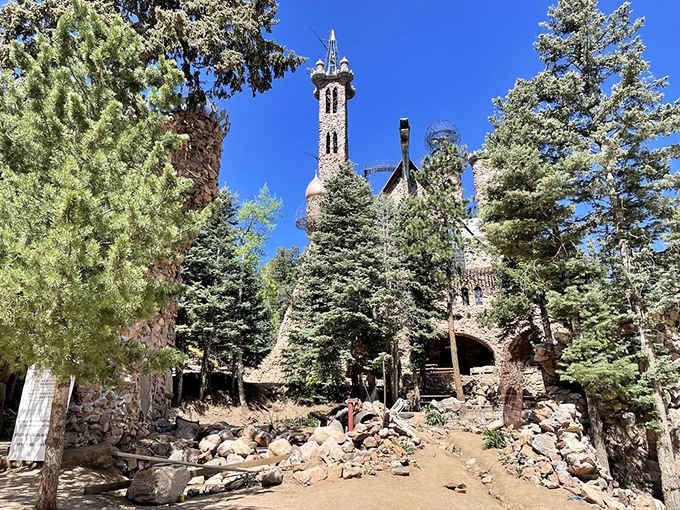 Tucked among ponderosa pines, the castle emerges like a secret waiting to be discovered by those willing to venture off the beaten path.
