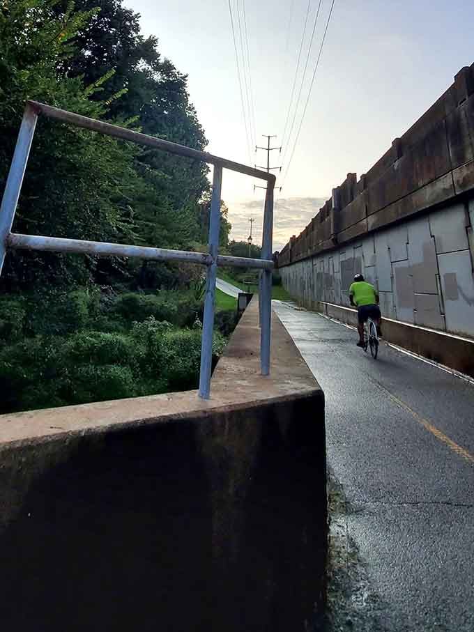 The W&OD Trail at dusk, where cyclists and history share the same quiet corridor through Arlington.