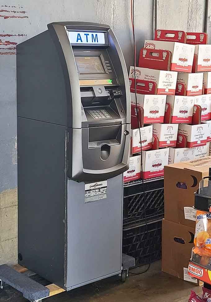 Even the ATM here feels charmingly no-nonsense, standing next to stacks of Broguiere's branded boxes like a very practical dairy sidekick.