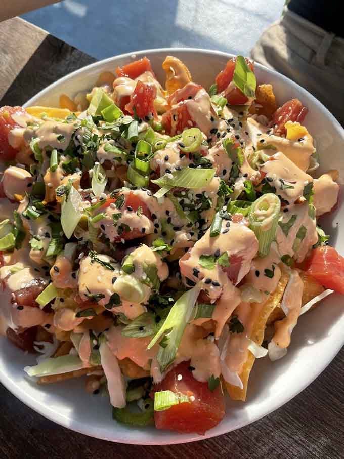 Spicy ahi tuna nachos loaded with scallions, sesame seeds, and creamy sauce. This dish proves Brooklyn Crab thinks well beyond the crab pot.
