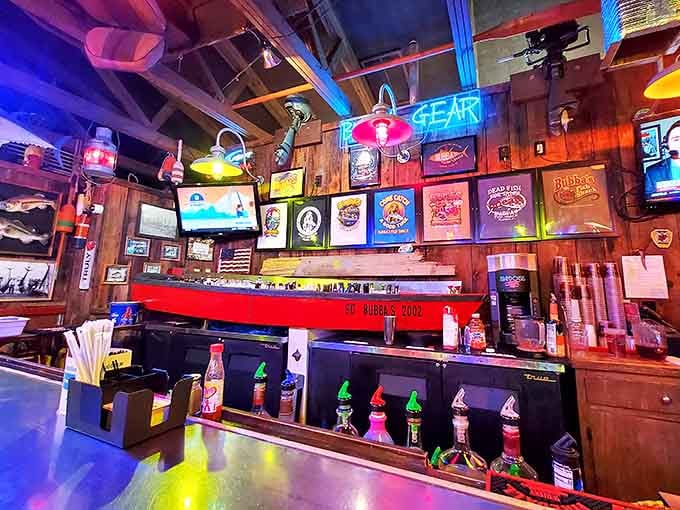 A bar built around a red boat hull with neon signs glowing overhead. Bubba's doesn't do anything halfway.