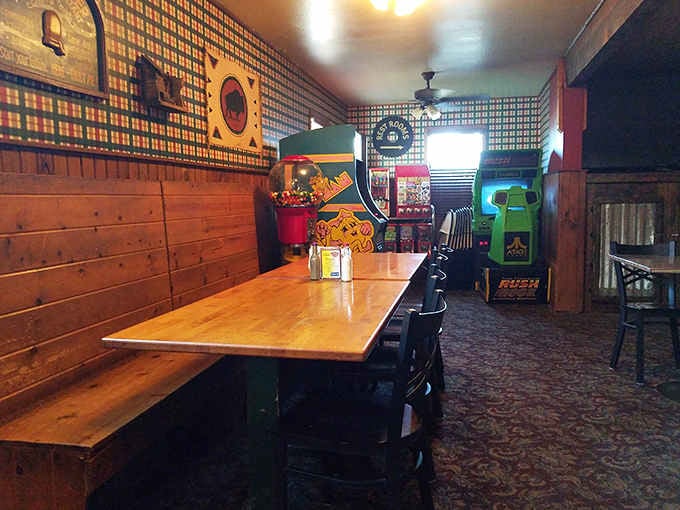 Vintage arcade games in the corner mean the kids are entertained and the pizza gets eaten in peace.