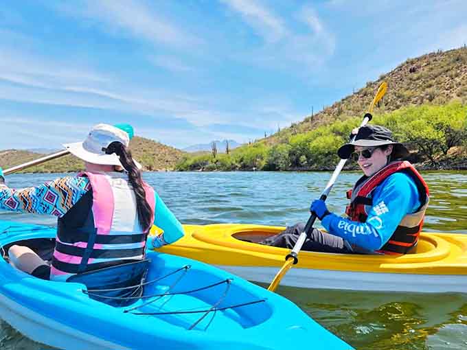 Kayaking past saguaros creates surreal moments your brain needs a minute to fully process and accept.