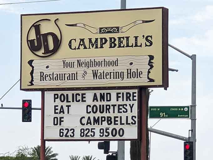 "Your Neighborhood Restaurant and Watering Hole." A sign that makes a promise and absolutely keeps every word of it.
