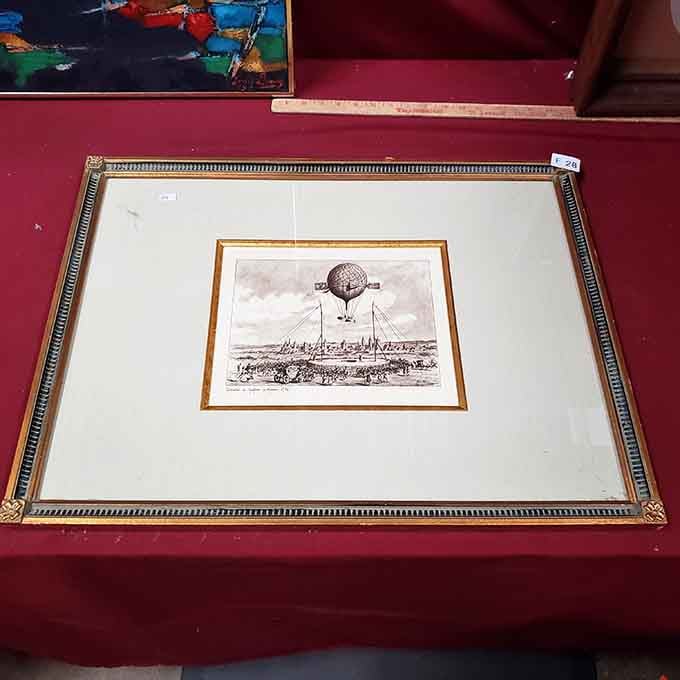 A framed hot air balloon print that looks like it floated straight out of an 18th-century adventure.