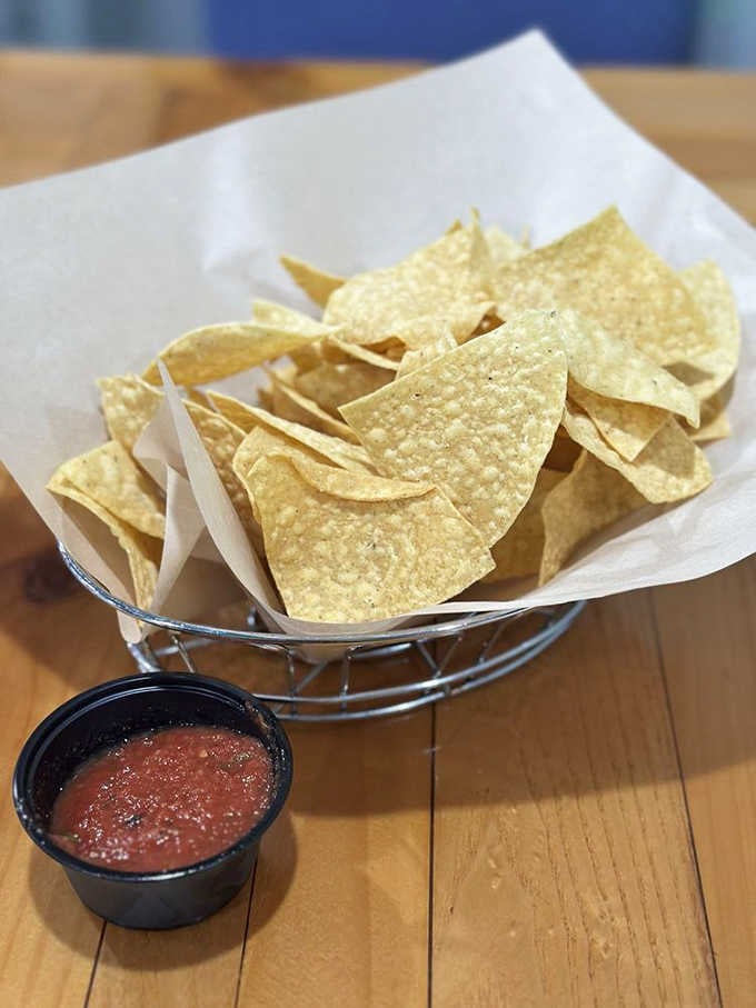 Crispy chips and bright red salsa, simple as a handshake and just as welcoming.