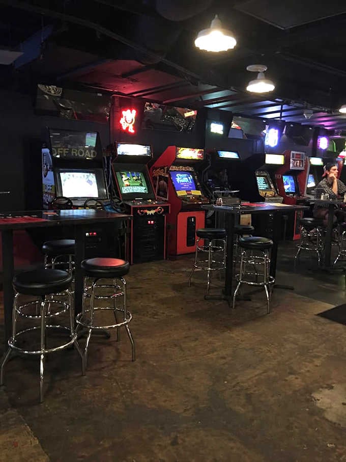 Street Fighter II cabinets with barstools pulled up, because some rivalries deserve a comfortable seat and a cold drink.
