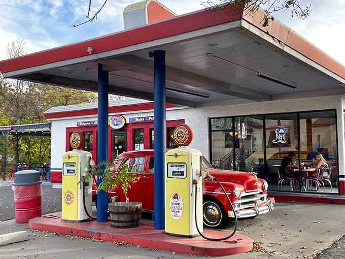 Vintage gas pumps and classic cars create the perfect backdrop for remembering when service stations had actual service.