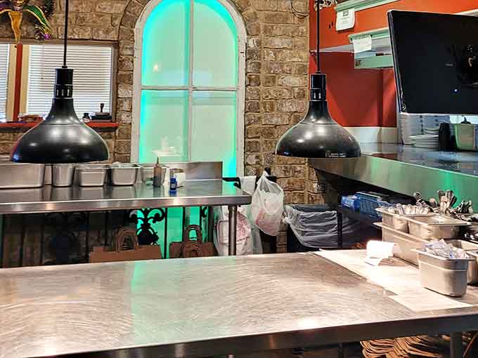 Behind that arched window and glowing teal light, something genuinely delicious is always in the works.