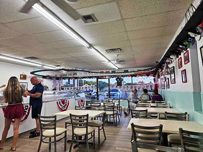 Customers at the counter, the train track looping overhead, festive bunting on the walls &mdash; this place hums with real joy.