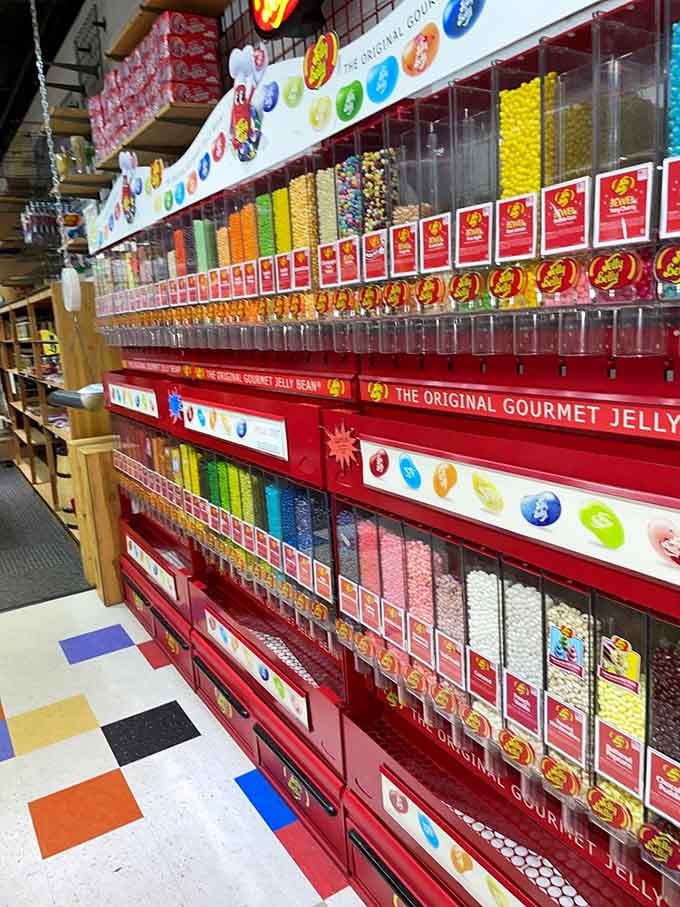 A towering wall of Jelly Belly dispensers stretching into the distance, a flavor rainbow that demands serious decision-making.