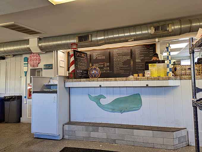 A painted whale on the counter wall and a chalkboard full of specials. This ordering window has personality.