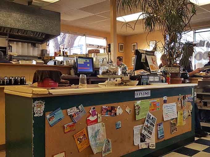The order counter at Dot's is covered in community flyers, local color pinned right where you can see it.
