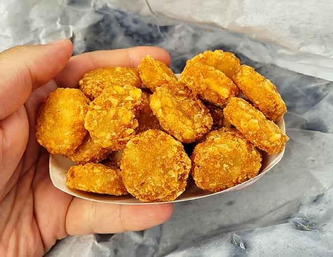 Tater tots arranged like little golden nuggets of joy, each one a tiny promise that everything's going to be just fine.