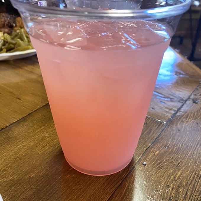 That pink lemonade is cold, refreshing, and the perfect companion for a plate piled high with smoked meats.