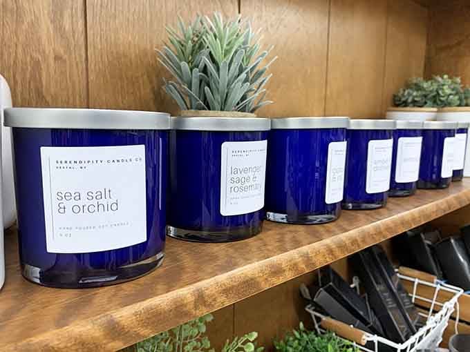Hand-poured soy candles in cobalt blue jars, scented with lavender sage and sea salt, because your nose deserves a treat too.