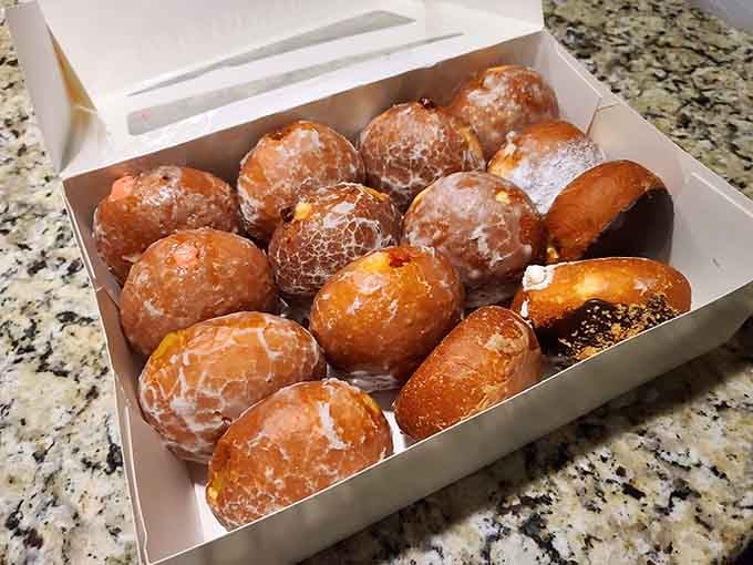 Paczki and donuts together in one box, like assembling the Avengers but significantly sweeter and more fattening.