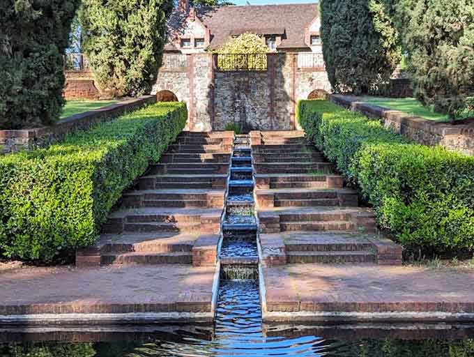 Manicured hedges, cascading water channels, and total serenity. Hard to believe a working mine sat just steps away.