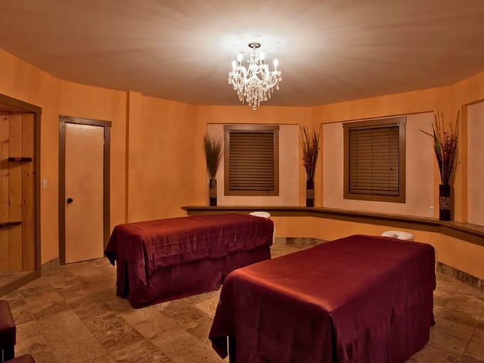 Two massage tables, a crystal chandelier, and warm terracotta walls. Your shoulders just relaxed reading that sentence.