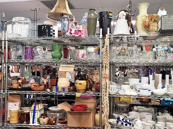 Glassware, vases, lamps, and ceramics stacked high. Every shelf holds something your kitchen or living room desperately needs.
