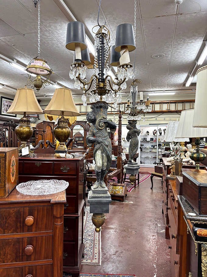 Those figural candelabra floor lamps are the kind of statement pieces that make an entire room stop and pay attention.