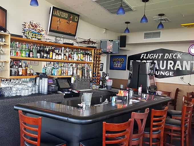 The bar area offers a well-stocked selection and runway views that beat any sports channel programming hands down.