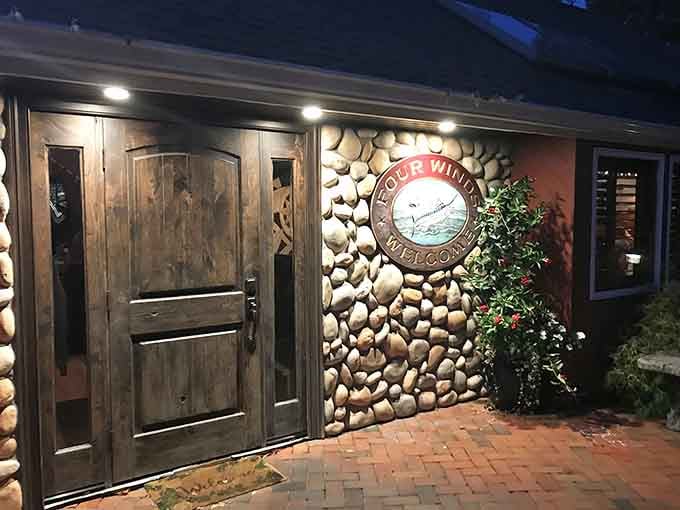 River stone walls and warm lighting greet you at the entrance, setting the mood before you've even sat down.
