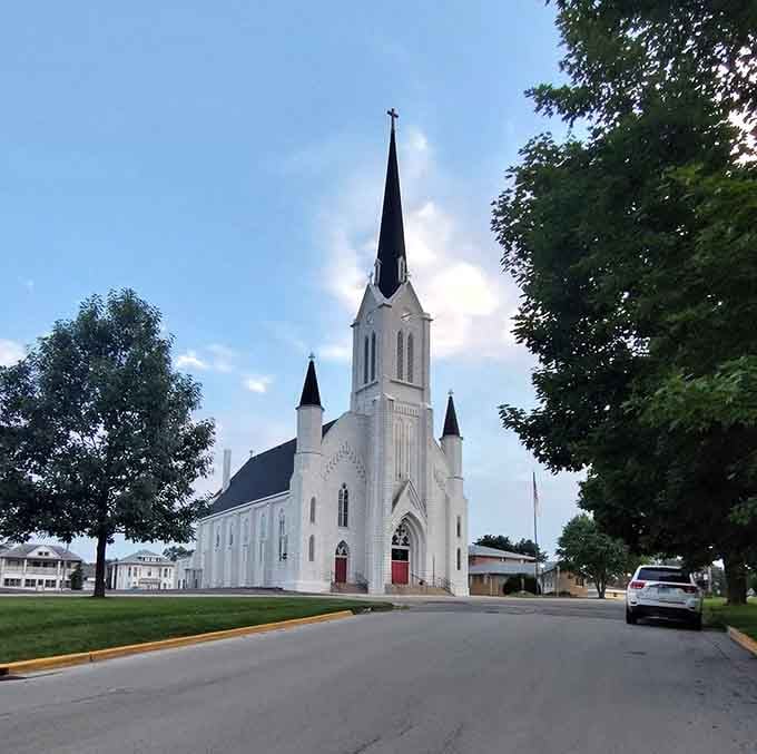This stunning white church spire reaches skyward like a beacon, guiding both the faithful and architecture enthusiasts to its doors.