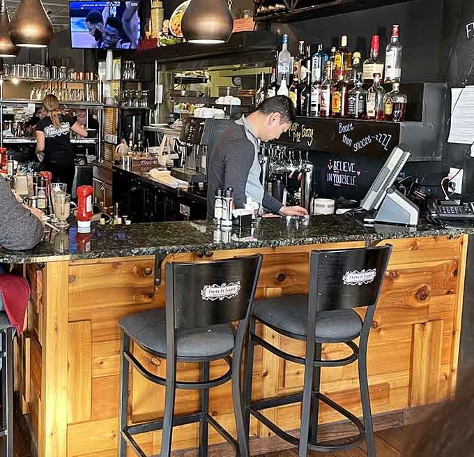 A warm, wood-paneled bar stocked with everything you need to toast to a very good decision.