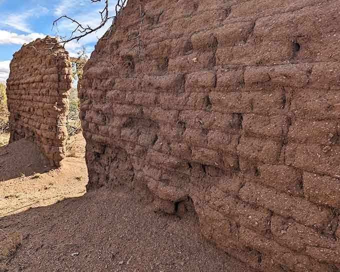 Crumbling adobe walls reveal their construction secrets, like opening a time capsule one brick at a time.