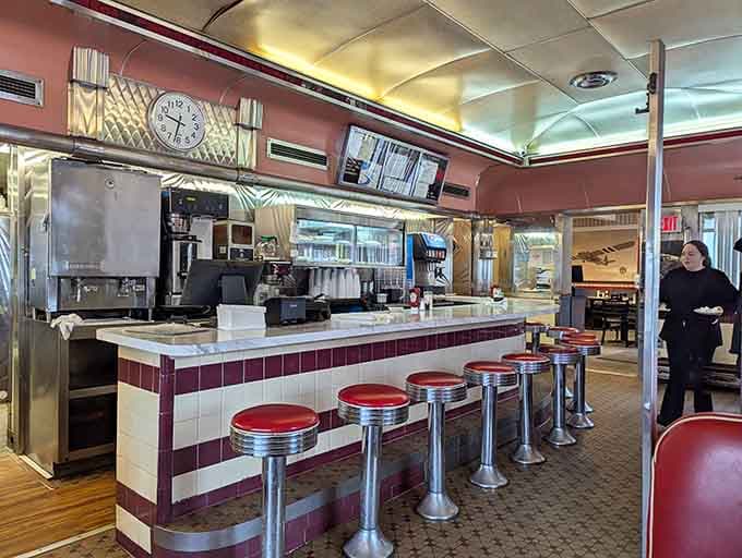 Chrome stools, burgundy tile, and a curved ceiling that gleams, this counter is straight out of a diner lover's dream.
