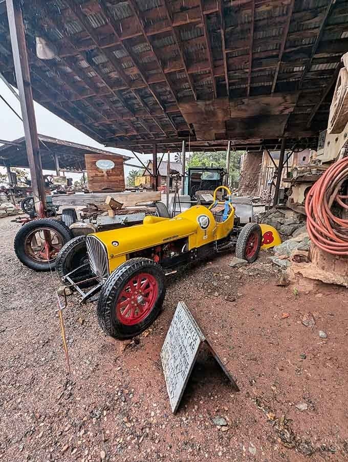 A bright yellow vintage race car proves not everything here moved at mule-cart speed back then.