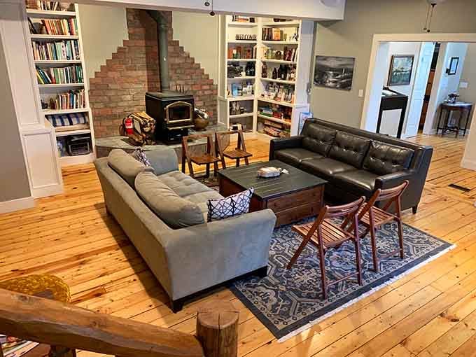 Bookshelves, a wood stove, and leather sofas. This common room is basically a hug you can sit in.