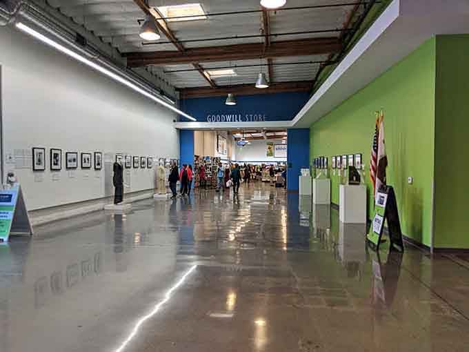 The polished hallway leading into the store, where framed artwork lines the walls and the real shopping adventure is just ahead.