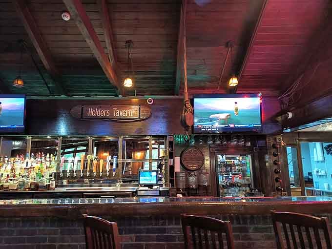 The bar area at Holders Tavern offers a cozy spot to enjoy a cold one while waiting for your table.