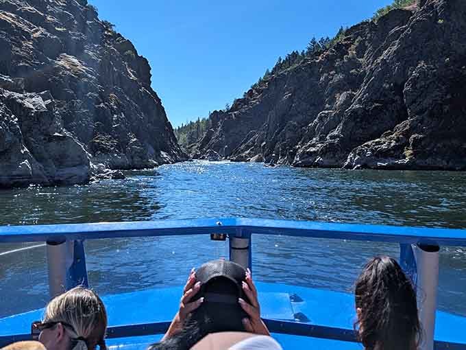 Threading through narrow passages between rock walls that seem close enough to touch but aren't, thankfully for everyone involved.
