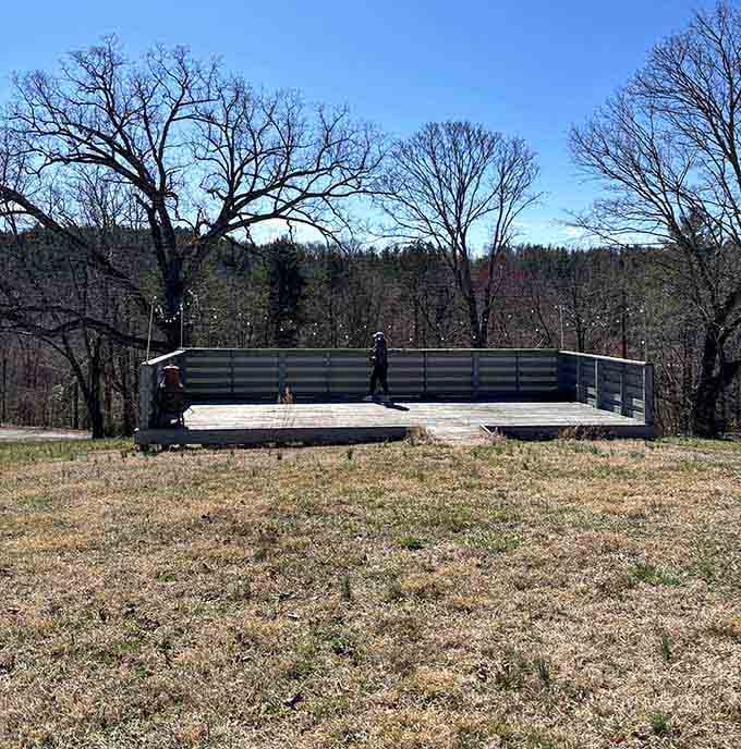 An outdoor stage sitting in an open field, because even ghost towns deserve a spotlight.