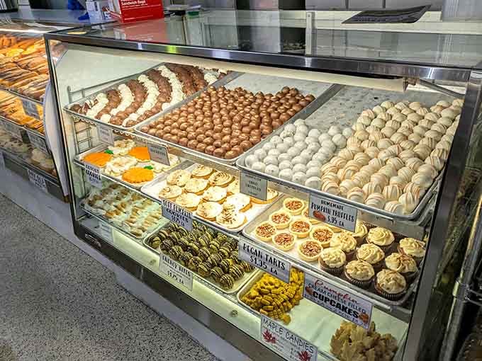 Chocolate truffles, pecan tarts, pumpkin tarts, and cream cheese cupcakes packed into one glass case that deserves its own zip code.
