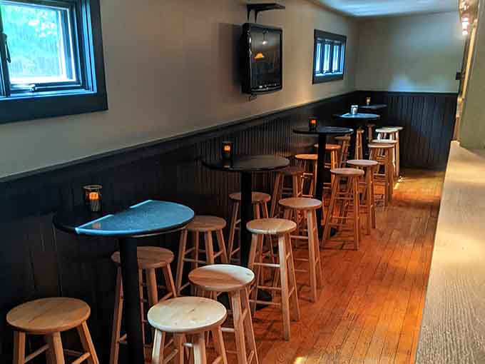 High-top tables, wooden stools, and candlelight. The bar side of Heston is casual, comfortable, and completely inviting.