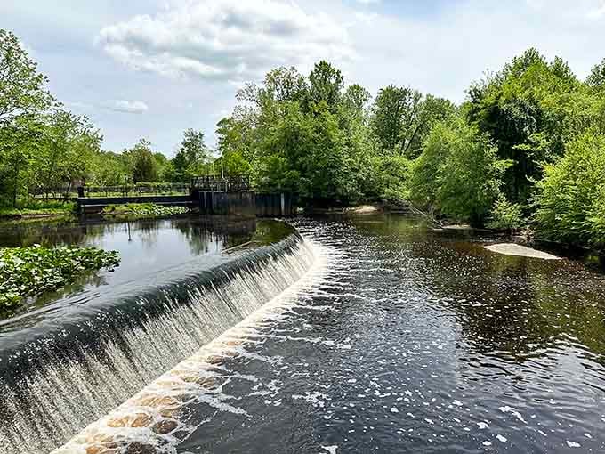 Water spilling steadily over a low dam on the Rancocas Creek. Peaceful, powerful, and completely free to stand and admire.