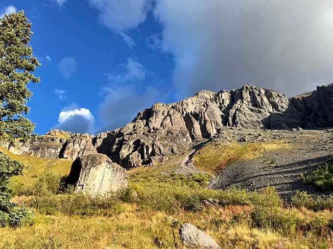 Ancient rock faces catch the last warm light of the day, telling a geological story that makes human history feel very young.