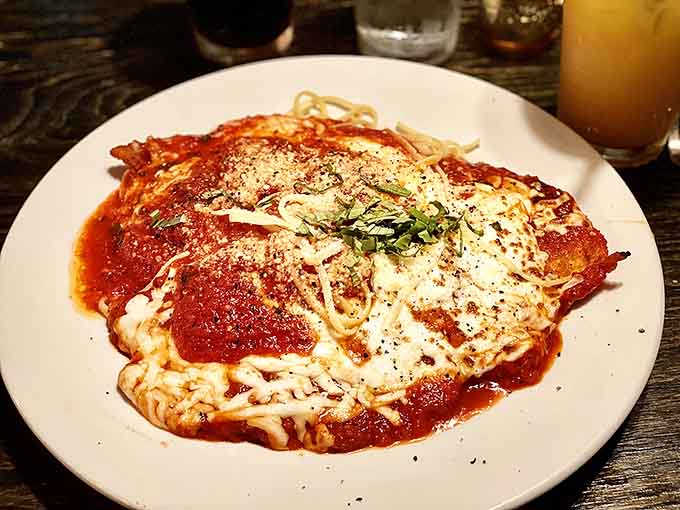 Chicken Parmigiana blanketed in homemade tomato sauce and melted mozzarella. Classic, comforting, and absolutely no notes.