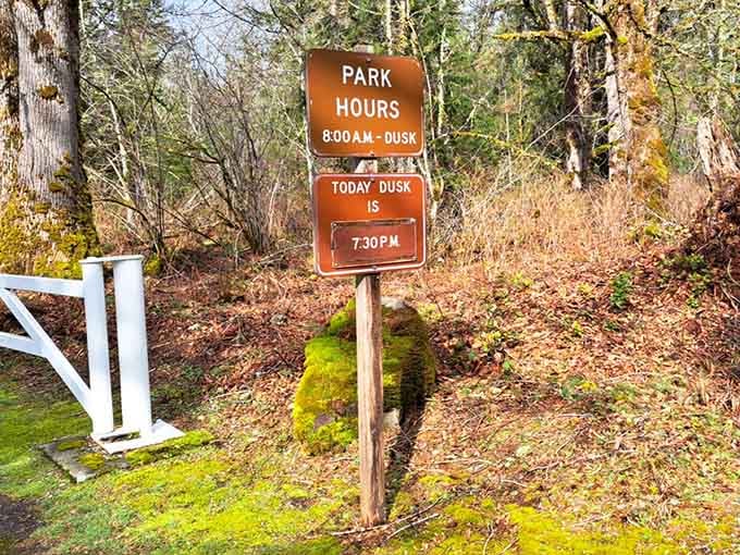 Park hours posted clearly, because even paradise has a schedule and dusk waits for no one.