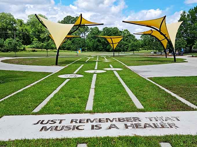 "Just Remember That Music Is A Healer" is carved right into the ground at Kinston Music Park, and honestly, same.