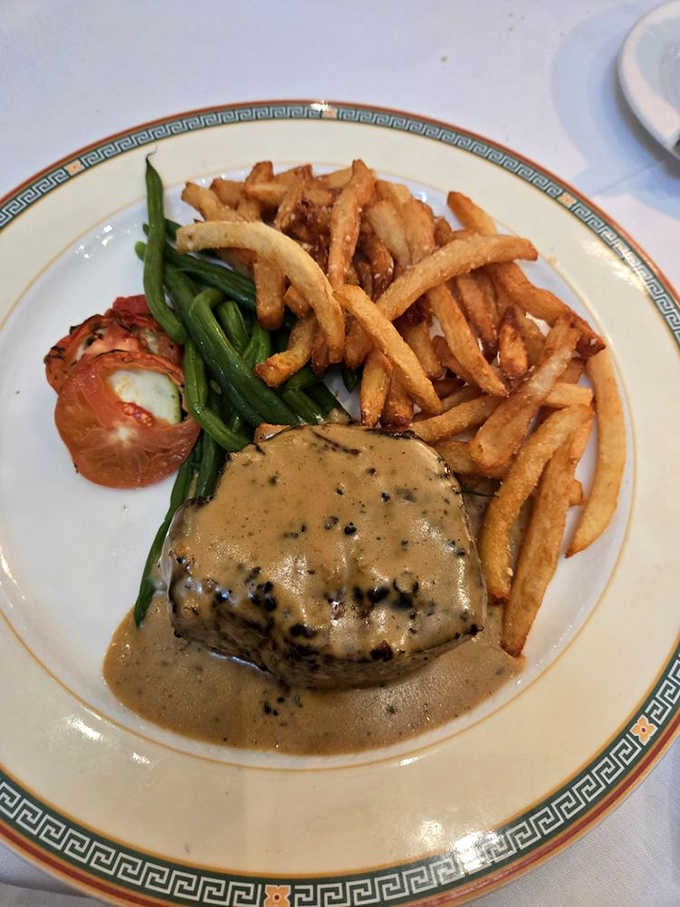 Filet mignon au poivre with hand-cut fries. A pepper-crusted masterpiece that proves France and Maryland were always meant to meet.