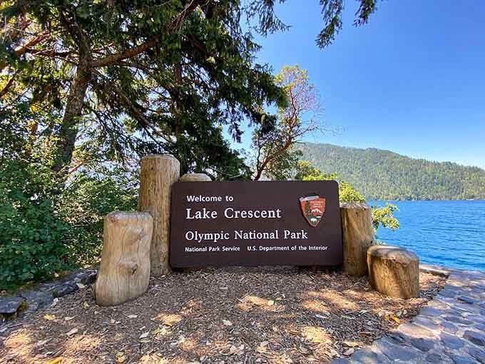 The welcome sign at Lake Crescent is modest. The lake itself is anything but.